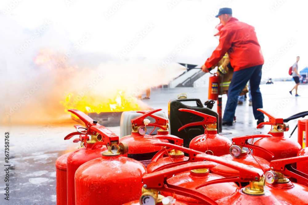 Many fire extinguishers in a fire safety lesson. The process of ...