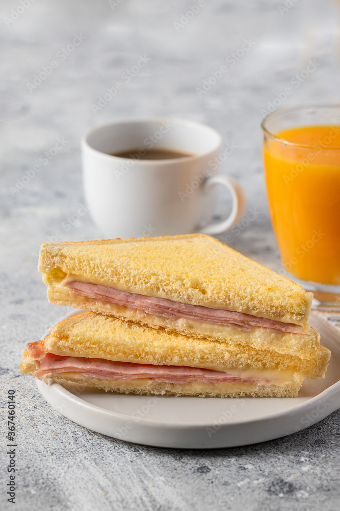 Foto de Stock Ham and cheese sandwich, cup of coffee with milk and ...