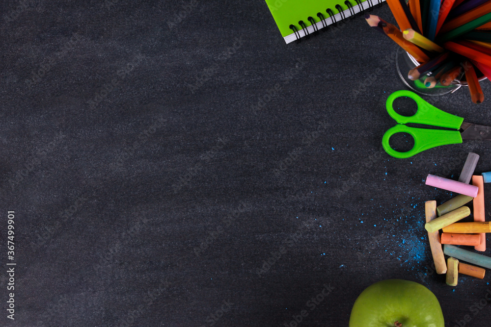 Colorful pencil in pot, green apple, crayons with crumbs, ruler ...