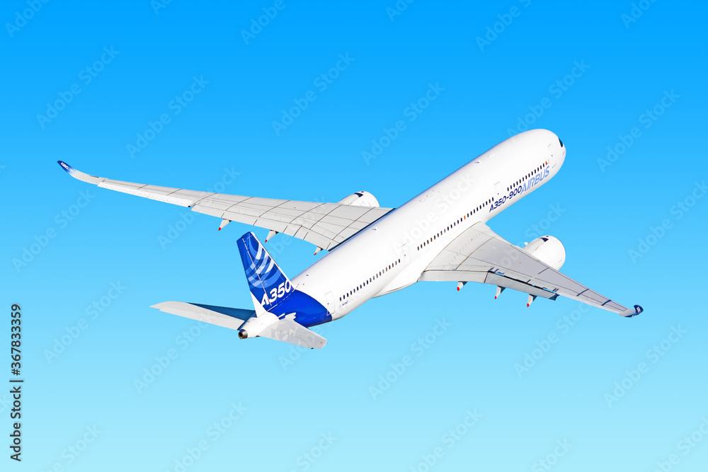 EADS airbus A350 airplane flying against blue sky background. Aerial ...