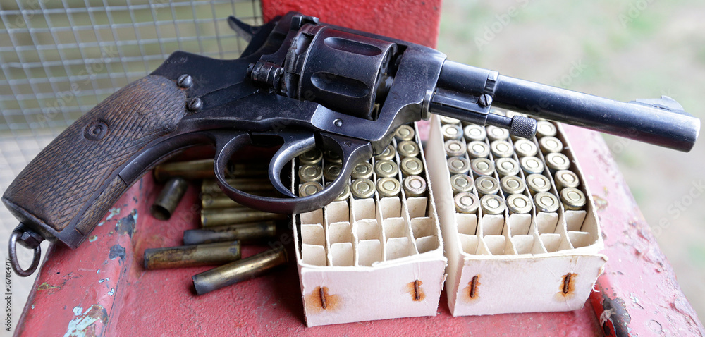 Pistol and submachine gun in the shooting range. Fire position. Stock ...