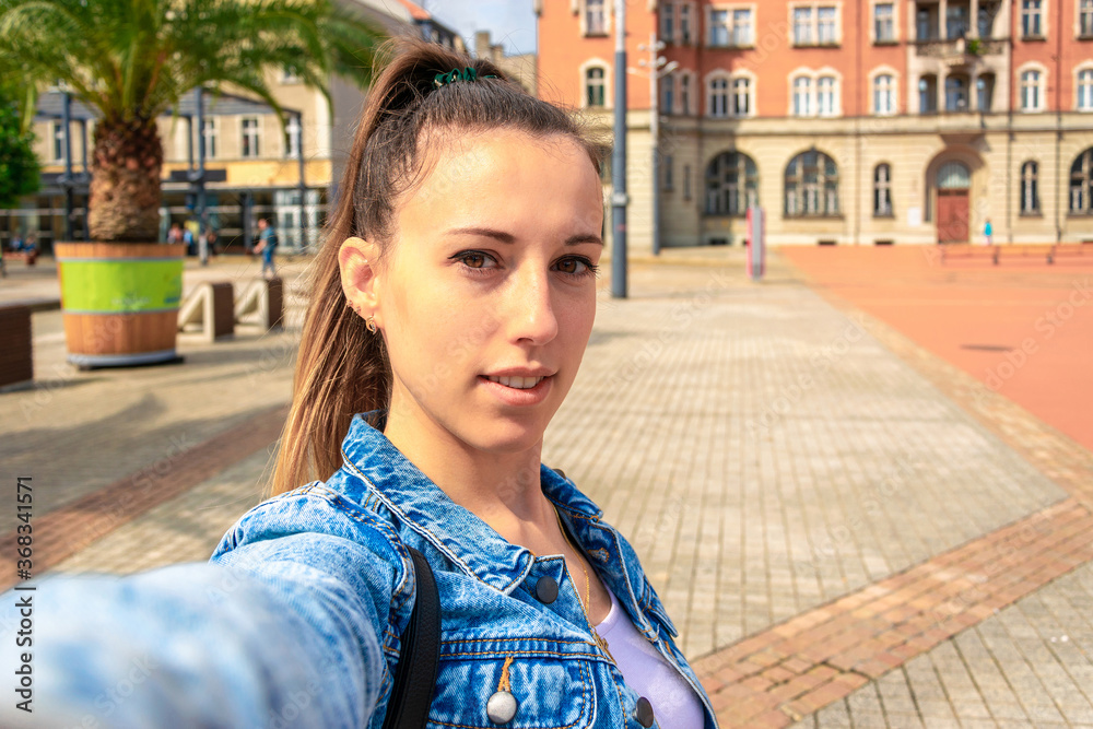 Making picture. Pretty female taking fun self portrait photo. Happy ...