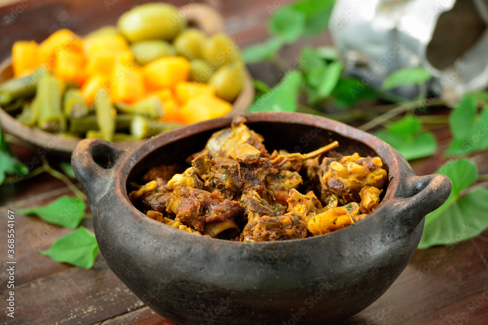 Brazilian gastronomy. Goat meat in the clay pot. Stock Photo | Adobe Stock
