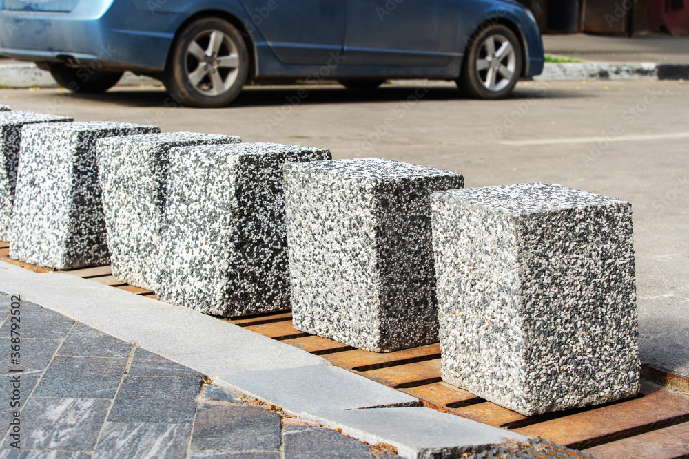 Concrete security blocks in the car park. Separation of the pedestrian ...