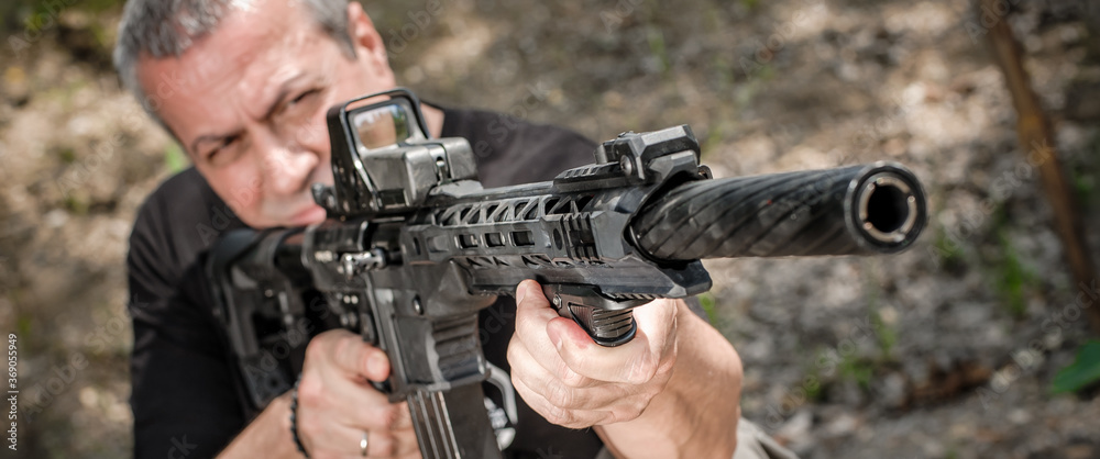Front view gun point of rifle machine gun. Firearm shooting and ...