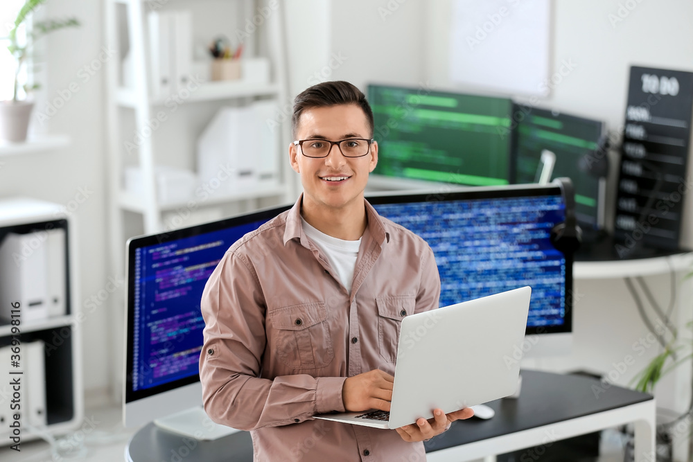 Portrait of male programmer in office Stock Photo | Adobe Stock