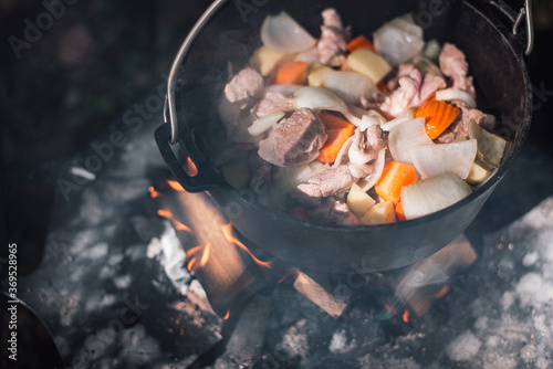 Preparing food on campfire in wild camping,Cooked food on a campfire on ...