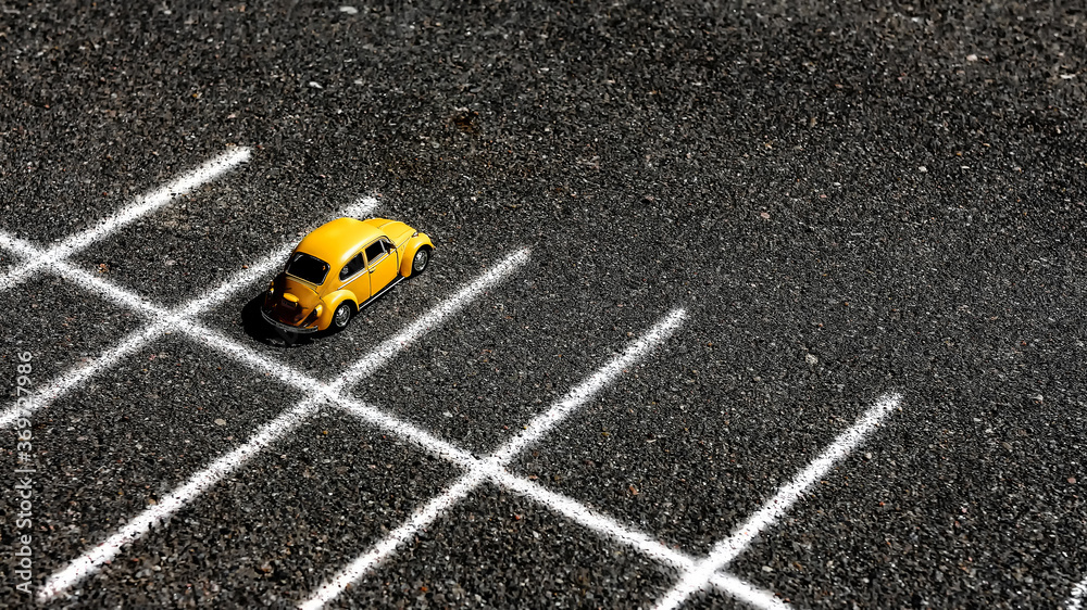 Minsk, Belarus-August 2020: a yellow car stands in an empty parking lot ...
