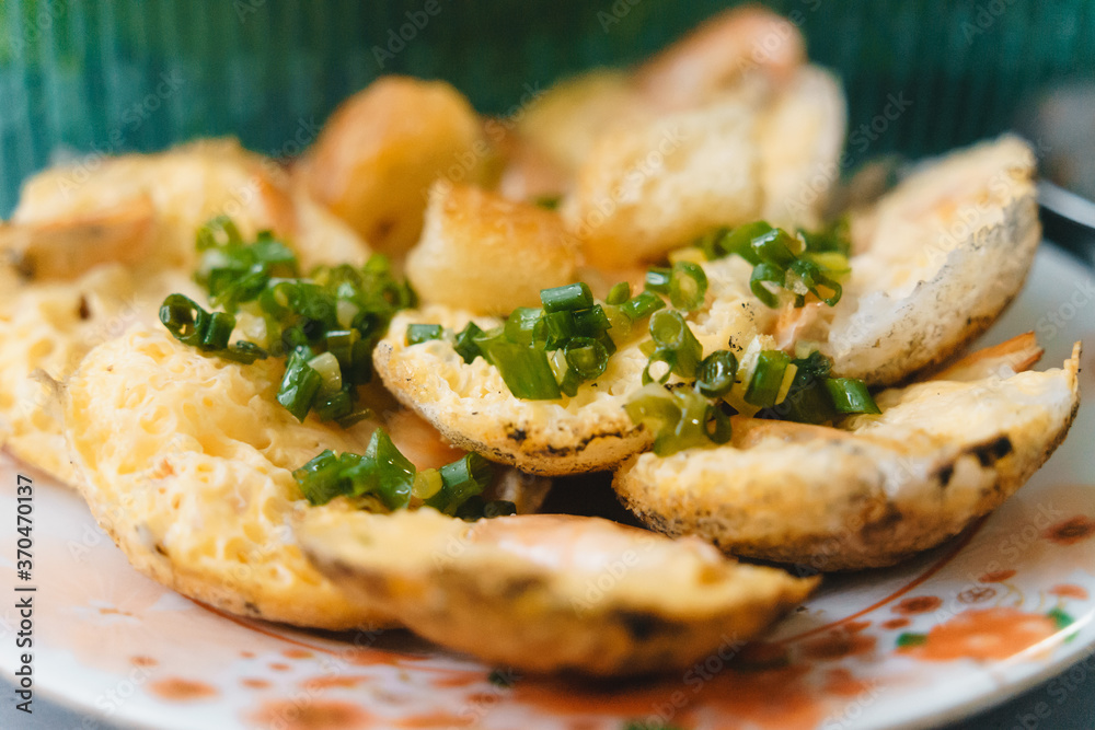 Vietnamese street food "banh can" make by rice powder with rice flour ...