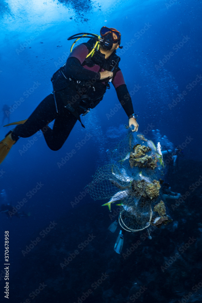 ghost net scuba diver reef conservation Stock Photo | Adobe Stock
