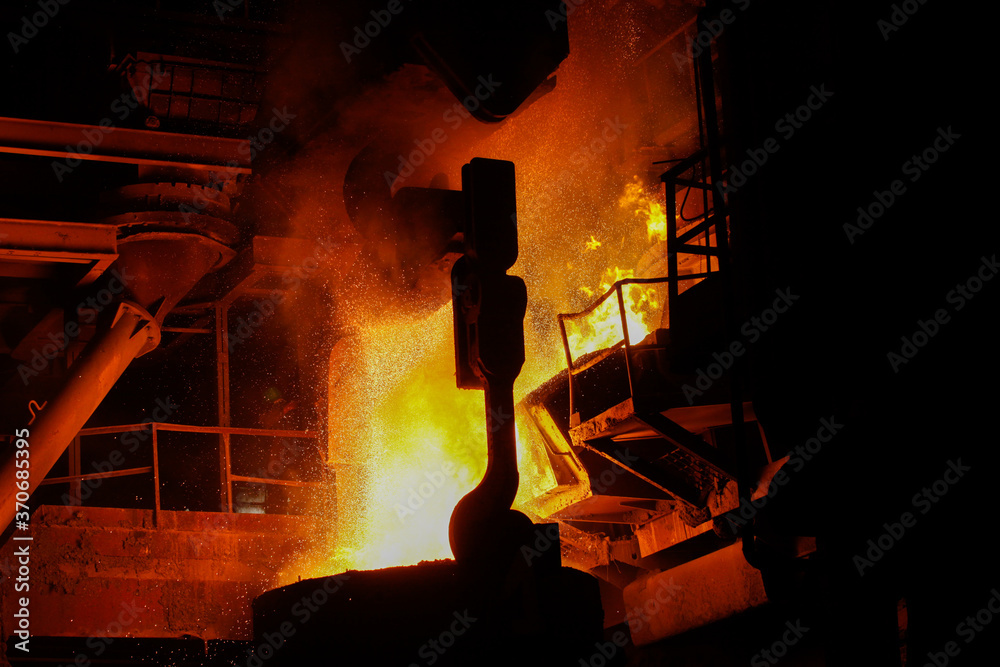 Foto de Stock Steel production in electric furnaces. Sparks of molten ...