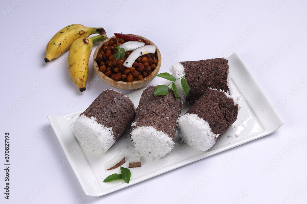 Ragi Puttu or Finger Millet steamed cake with bengal gram curry Stock ...