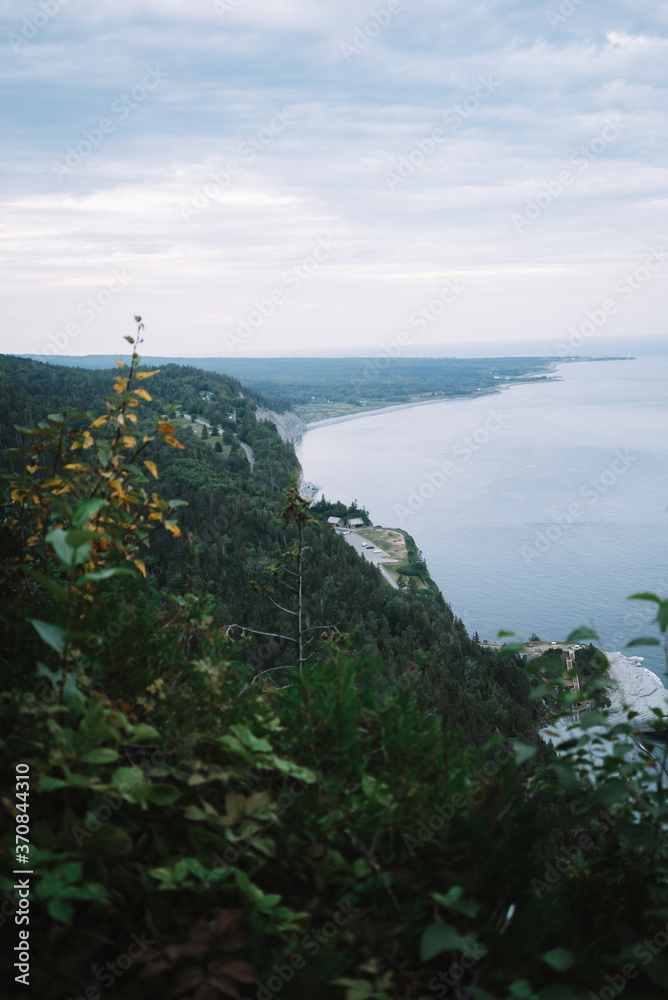 From above of rough cliffs covered with evergreen forest in endless ...
