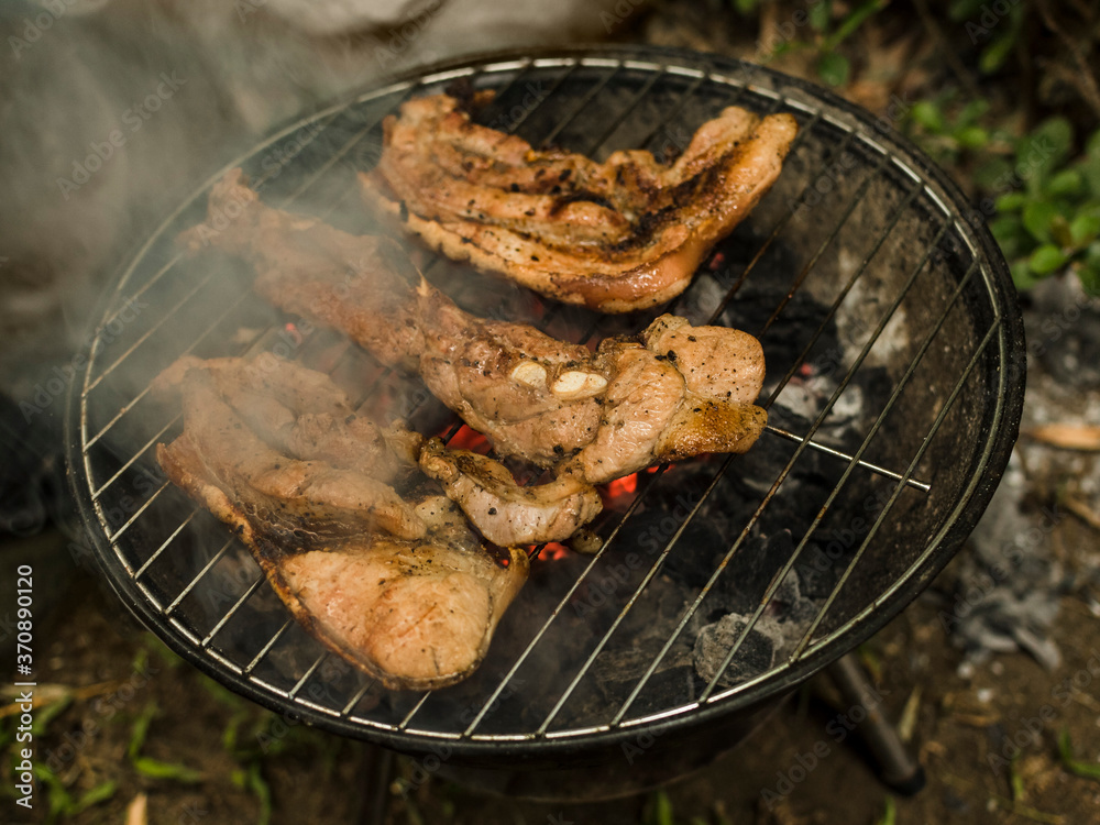 Photo Stock Several pieces of Liempo, or pork belly, cooked on a small ...