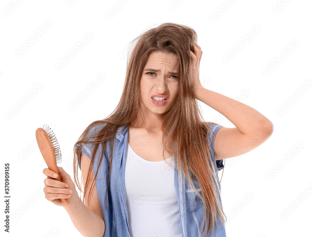 Stressed woman brushing hair on white background Stock Photo | Adobe Stock