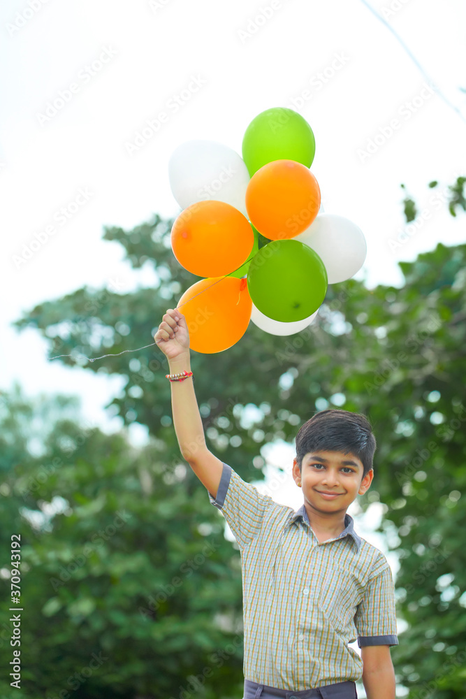 cute little indian boy with tri color balloons and celebrating ...