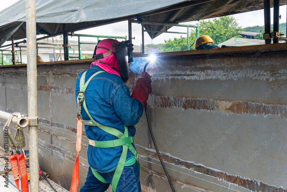 Photo Stock The welder is welding a steel structure work with process ...