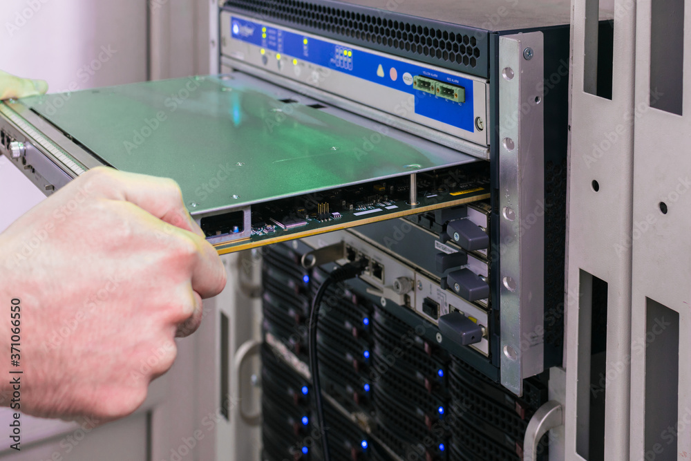 Installing a new motherboard in the server room. Data center hardware ...
