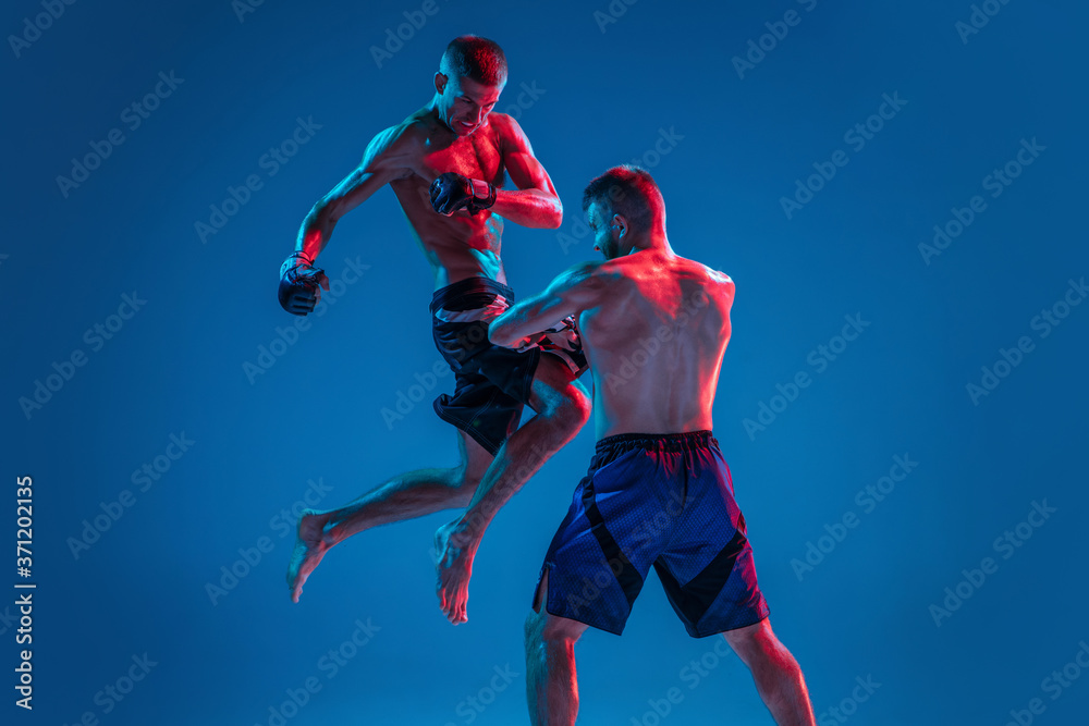 In flight. MMA. Two professional fighters punching or boxing isolated ...