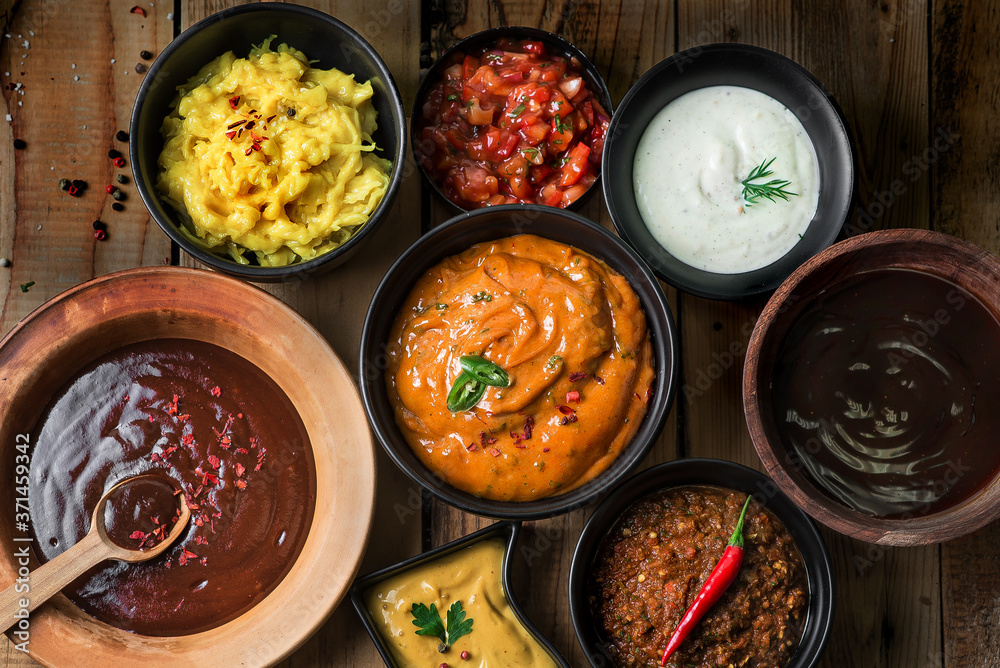 Assorted different types of sauces for dishes. Stock Photo | Adobe Stock