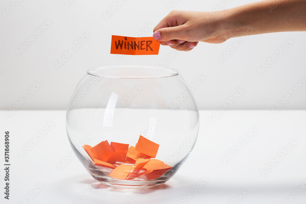 Child hand picking winner from a glass bowl, random name ballot, simple ...