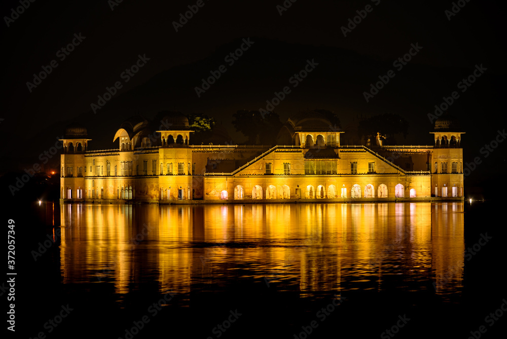 Illuminated night view of Jal Mahal 'Water Palace' is an architectural ...