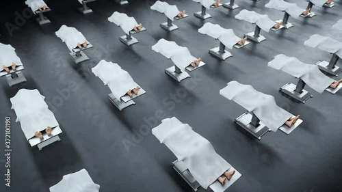 Multiple dead bodies in morgue, many corpses covered with white cloth ...