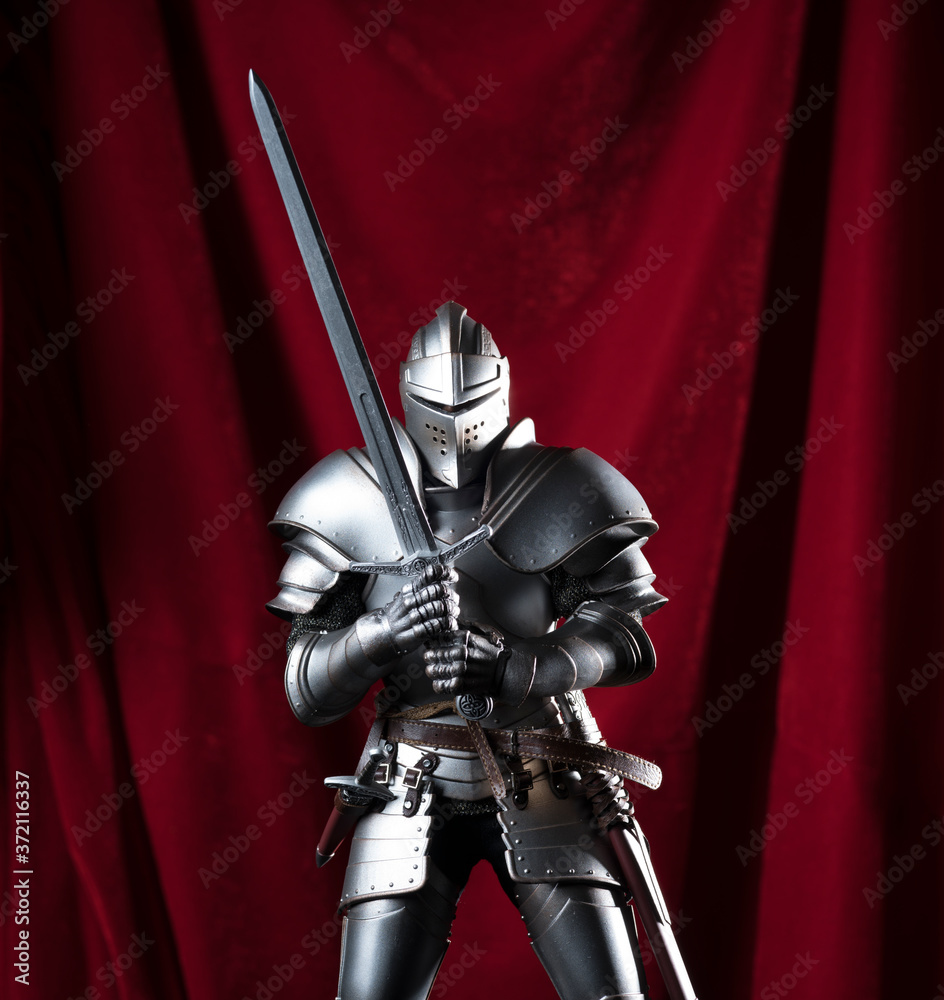 knight with sword and red velvet background Stock Photo | Adobe Stock