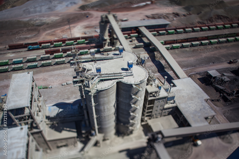 Mynaral/Kazakhstan: Modern cement plant in desert. Hopper cars on ...