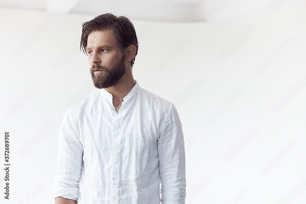 high key portrait photo on white cyclorama of a handsome bearded man ...