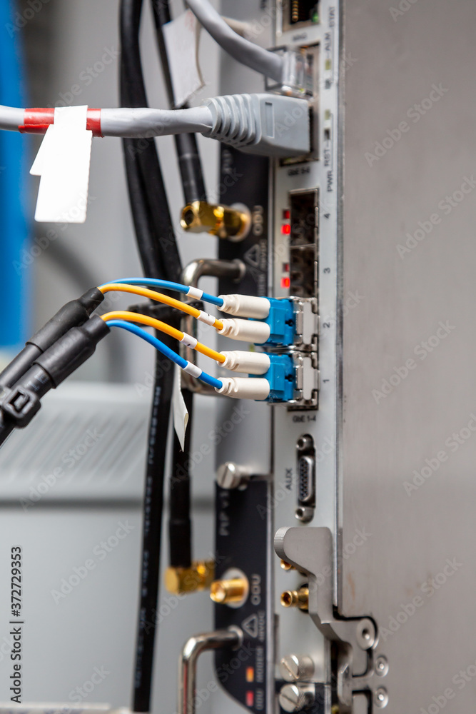 Fiber optic cables are connected to radio relay equipment. Close-up ...