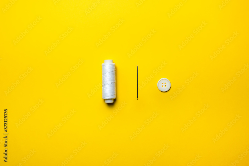 Photography in the style of minimalism. A spool of white thread, an ...