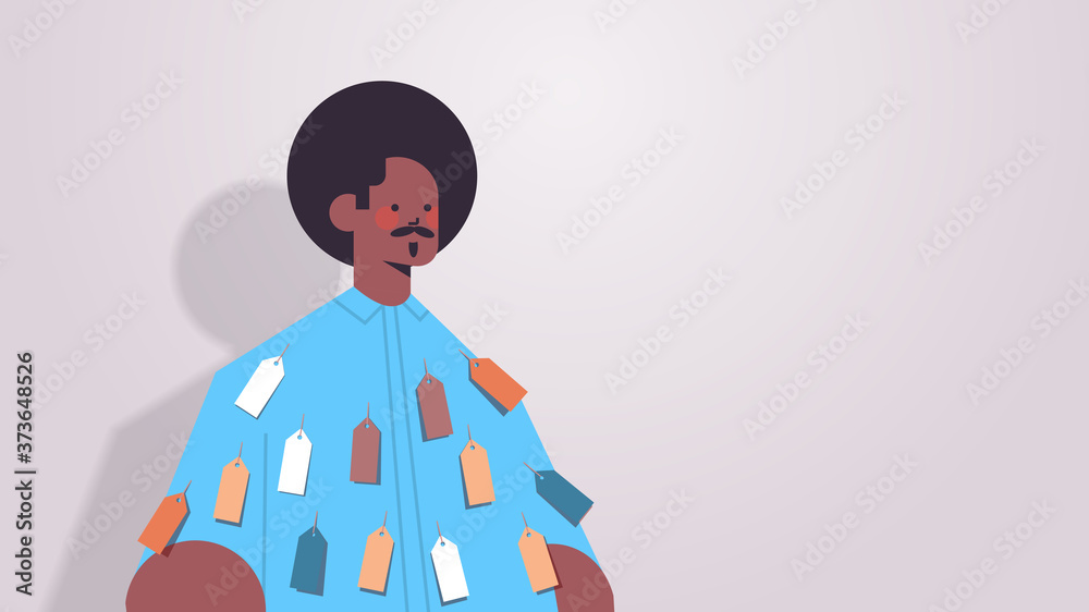 african american man with colorful tags labels on wear inequality ...