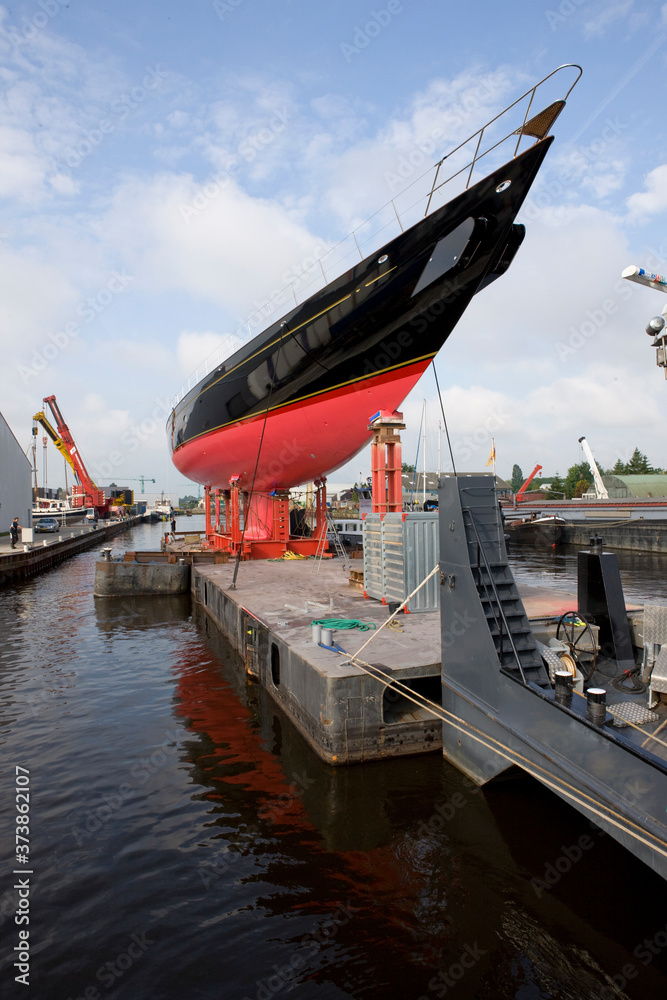 Launching of a super super sailing yacht in the harbor of Zwartsluis ...