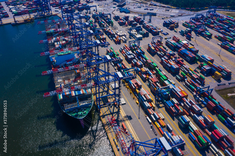 Container ship loading at port with crane, container ship carrying ...
