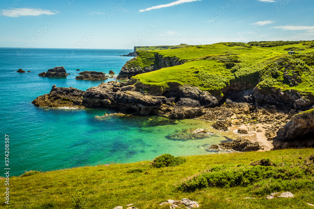 Turquoise sea at a secluded cove near Broad Haven on the Pembrokeshire ...