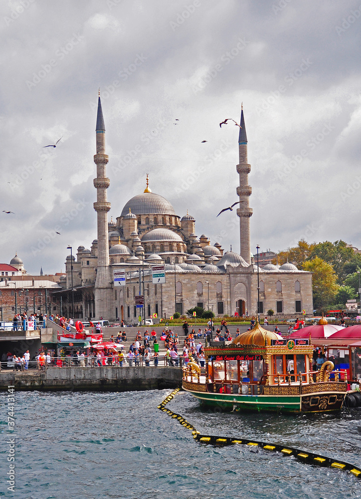 The Istanbul waterfront on the Golden Horn near the New Mosque is a ...