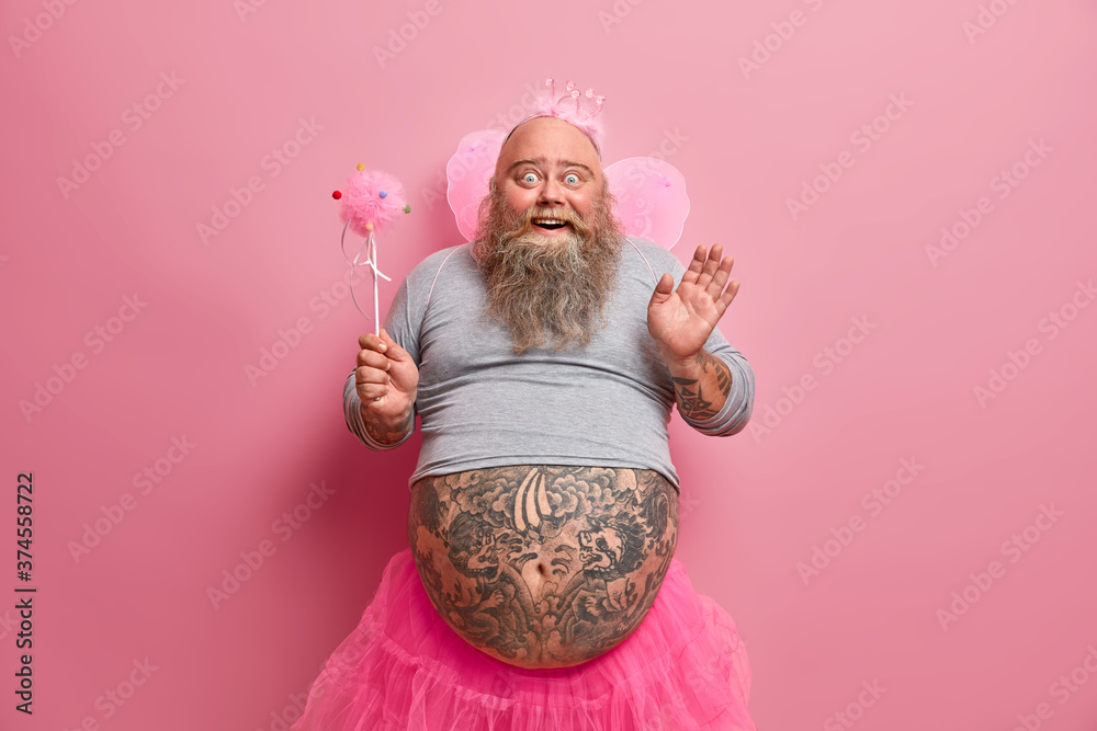 Photo of comic male fairy with thick beard and fat tattooed belly ...