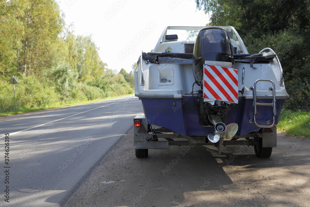 Motor boat on Car trailer back view on transom stern with powerful 100 ...