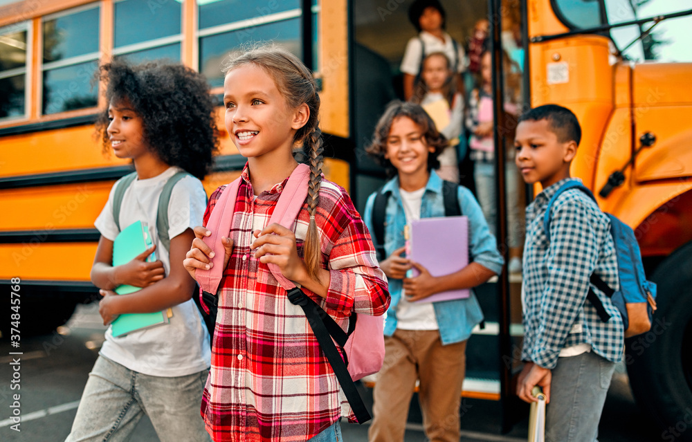 Children near school bus Stock Photo | Adobe Stock