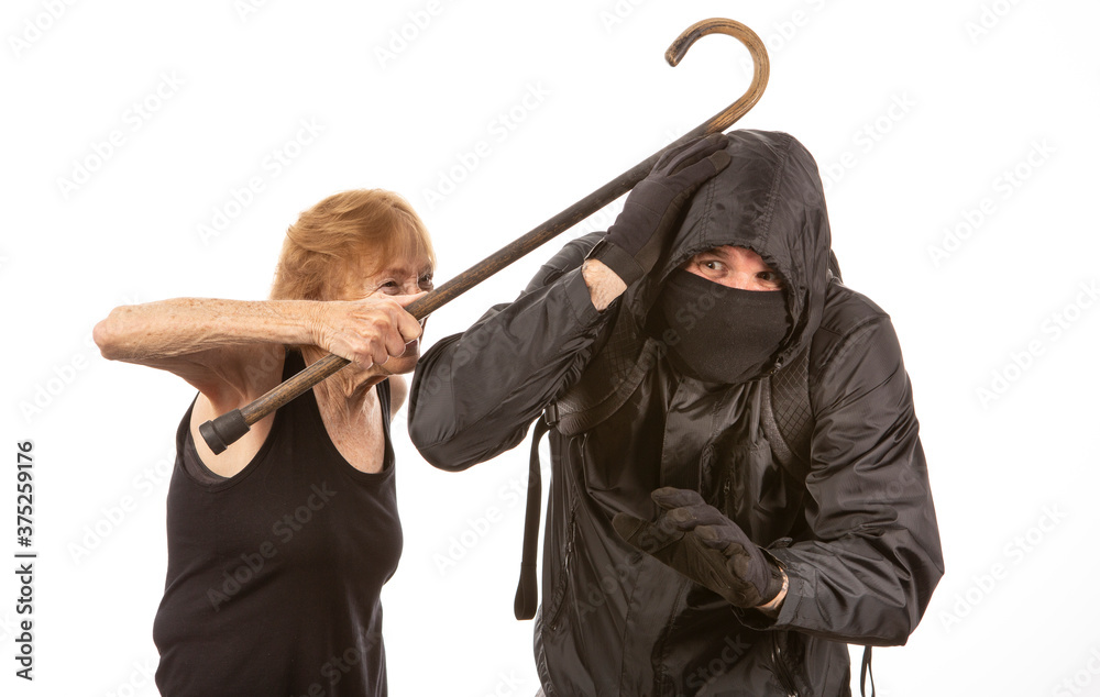 Aggressive senior citizen slapping a protestor across the head with her ...