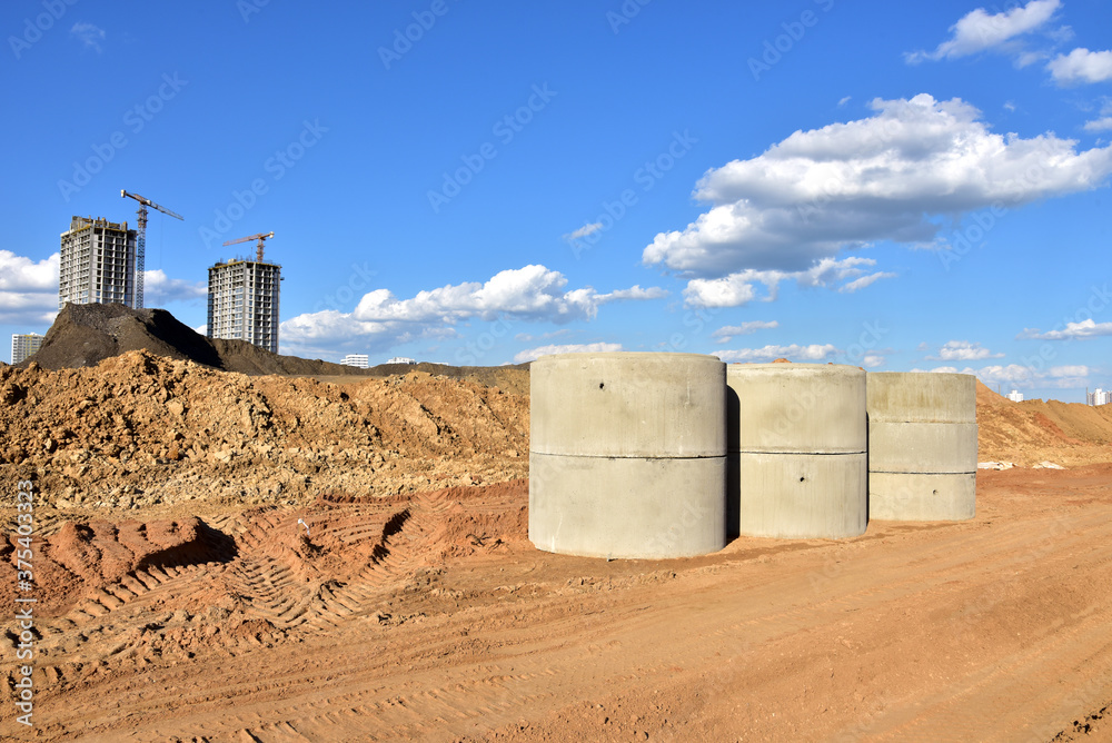 Laying concrete manholes and drain pipes for stormwater system ...