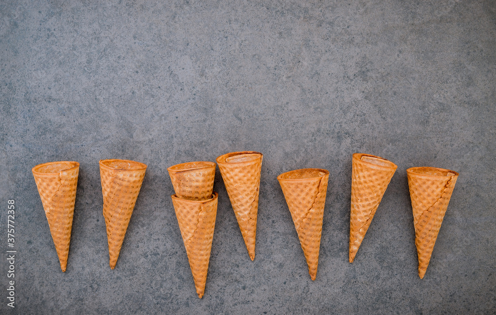 Flat lay ice cream cones collection on dark stone background . Blank ...