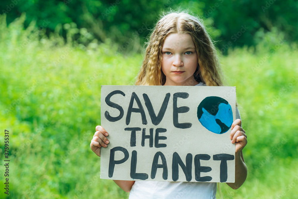 caucasian blonde girl activist with save the planet poster in park ...