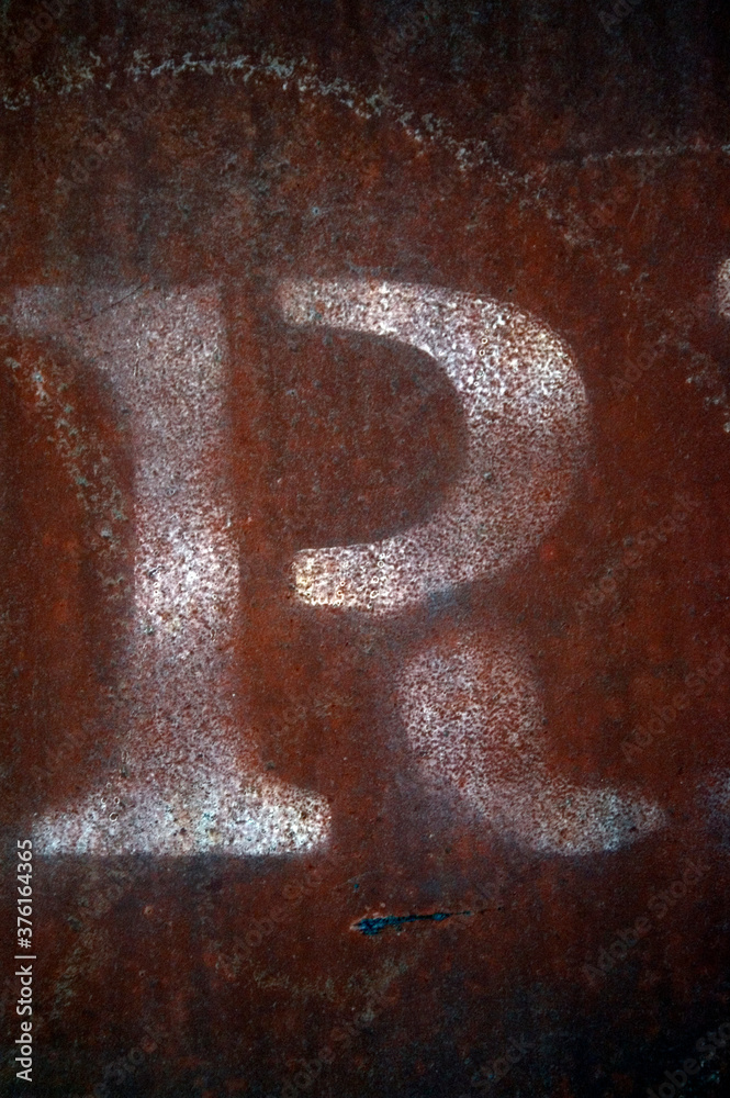 Old, faded, worn and used letters, alpha numeric set character that ...