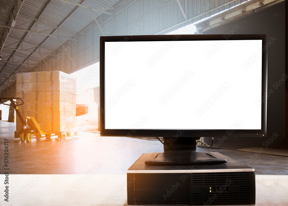 Desktop computer blank screen on table in distribution warehouse ...