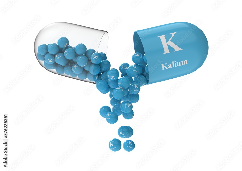 Open capsule with kalium from which the vitamin composition is pouring ...