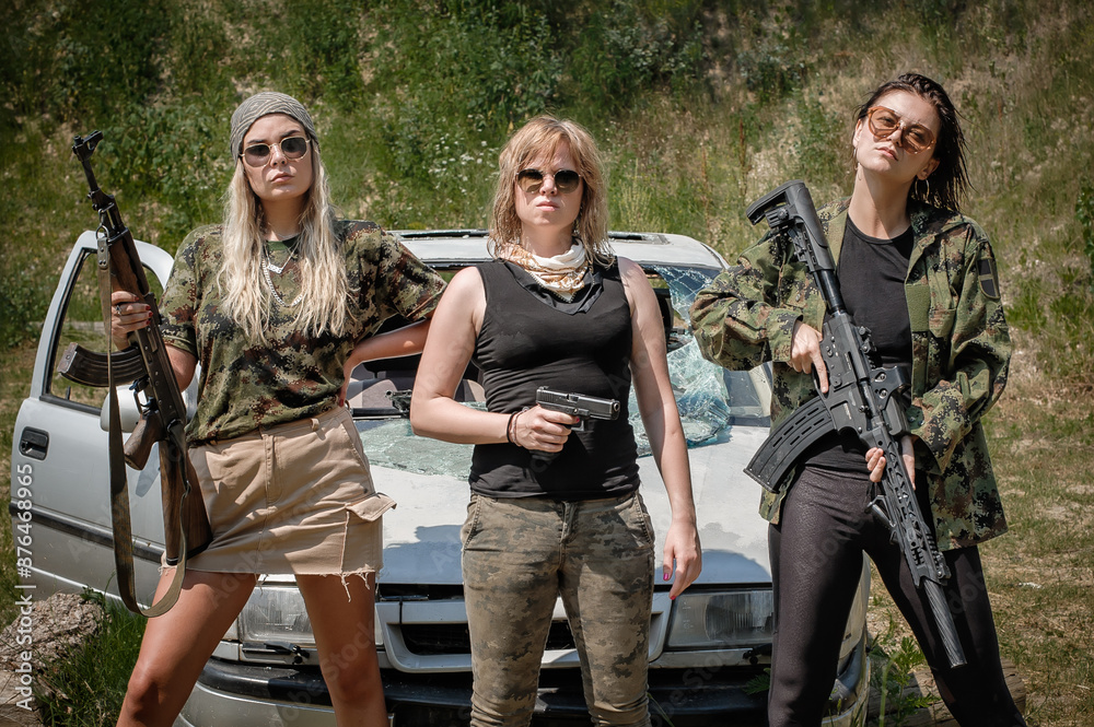 Military team of three attractive female soldier with guns, rifle ...