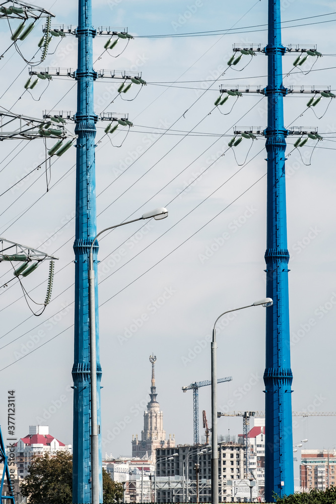 Two blue high voltage power line masts forming a natural framing ...