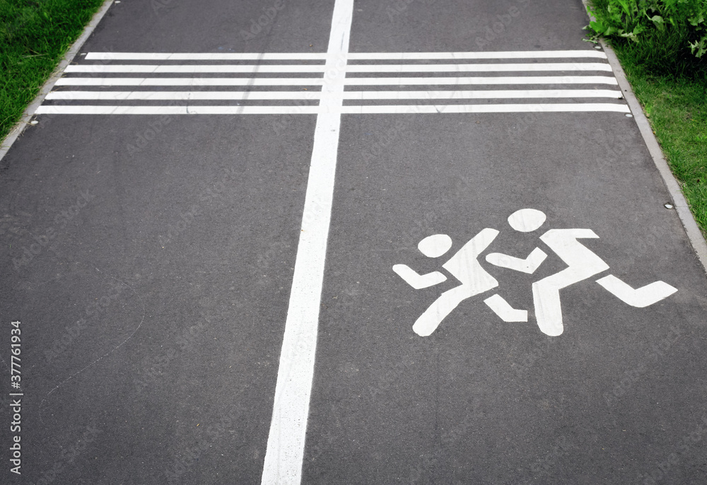 road with white dividing line, road signs, bike path with pedestrian ...